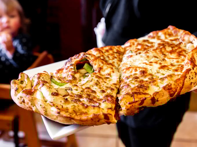 Calzone perfection: the pizza that decided to fold in on itself to keep all that melty goodness contained. Structural engineering you can eat.