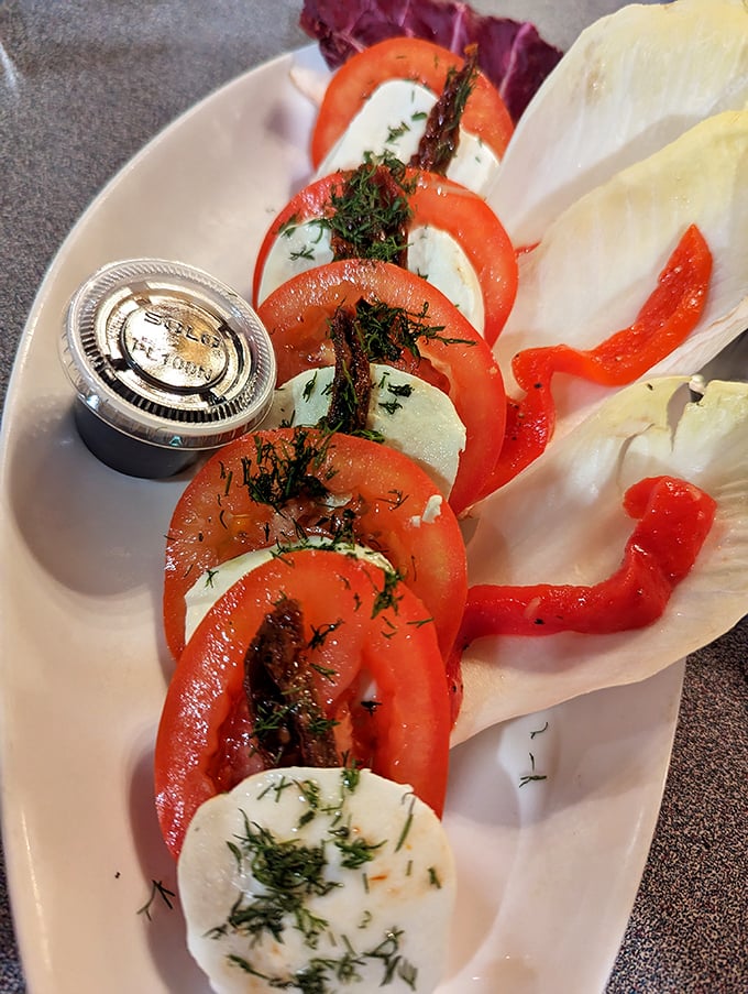 Caprese salad done right—where tomatoes and mozzarella perform their perfect duet with fresh dill playing conductor.
