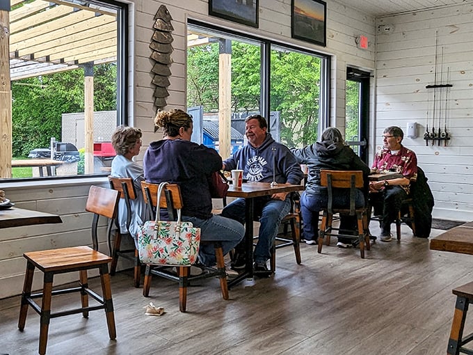 Real conversations happening over real food—the soundtrack to every great lakeside meal. No phones in sight, just people living in the moment.