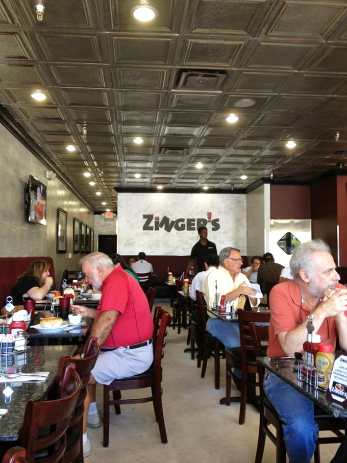 A snapshot of lunchtime at Zinger's—where conversations flow as freely as the coffee and nobody's checking their watch.