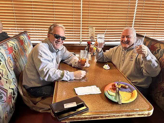 Happy diners toasting to good food and better company – the universal language of "we've discovered something special here."