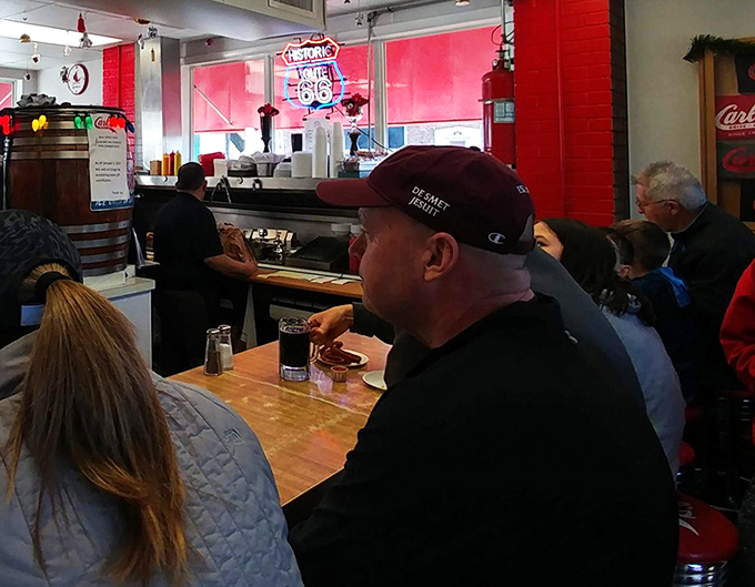 The counter seating creates an instant community of burger enthusiasts—strangers united by the universal language of "mmm" and "pass the napkins, please."