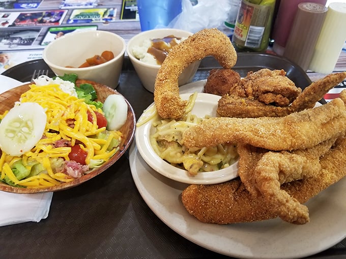 Catfish filets curved into perfect golden arcs—the kind of craftsmanship that makes you wonder if there's a Michelin star hiding somewhere in this kitchen.