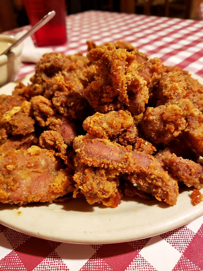This mountain of golden-fried goodness isn't just food—it's a testament to using every part of the bird. Crispy, savory, and unapologetically indulgent.