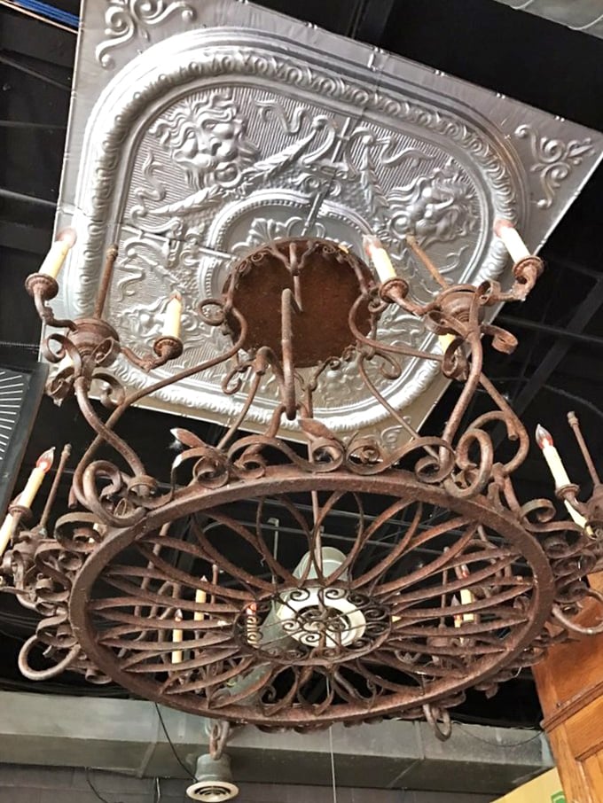 Even the lighting fixtures tell a story here—this vintage chandelier watches over countless first dates and family reunions sharing pancake balls below.