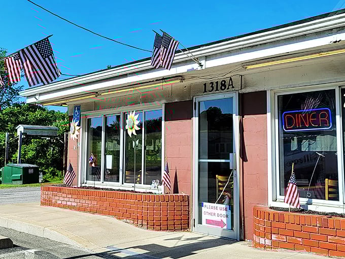 Jimis' Sunnyside Up Diner (daytime): Pink exterior, American flags, and a promise of breakfast that'll make you forget all about your fancy brunch reservations.