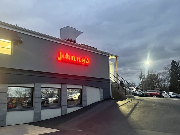 Johnny's red neon sign cuts through the darkness like a lighthouse for the steak-starved. Follow the glow to beefy bliss!