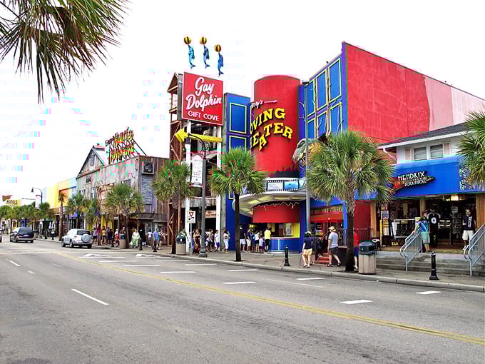 Neon signs and colorful storefronts define Myrtle Beach's famous boardwalk. Vacation mode activates the moment you see this view!