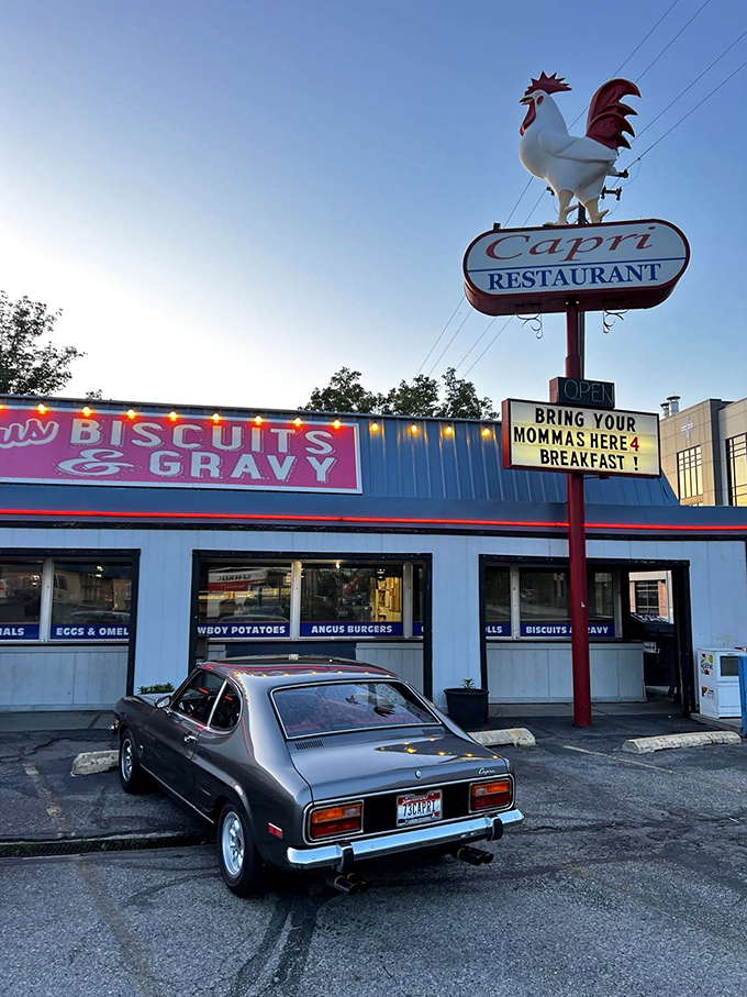 Classic cars and classic breakfasts—a perfect pairing. That "Famous Biscuits & Gravy" banner makes a bold claim it absolutely backs up.