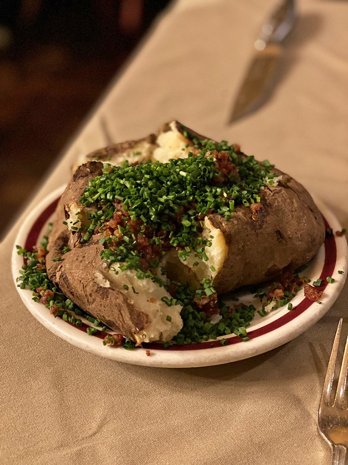 A baked potato that's dressed better than most people at dinner – loaded with all the fixings and ready for its close-up.