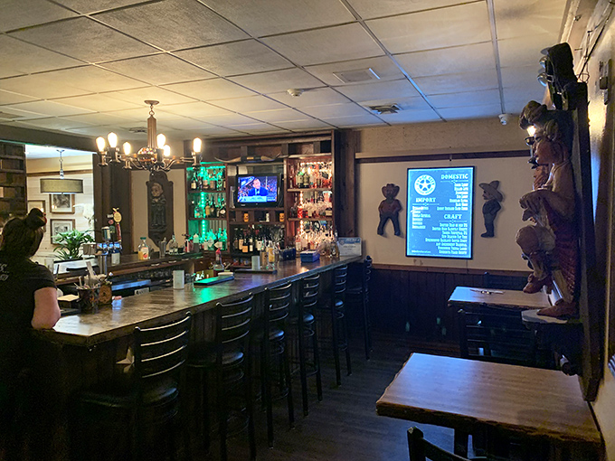 This isn't just a bar—it's command central for cocktail crafting and pre-dinner anticipation. Those cowboy figures stand guard over liquid happiness.