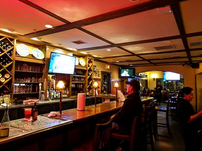 The bar area: where "I'll just have one glass" becomes an evening of wine and conversation. Cozy lighting makes everyone look like a movie star.