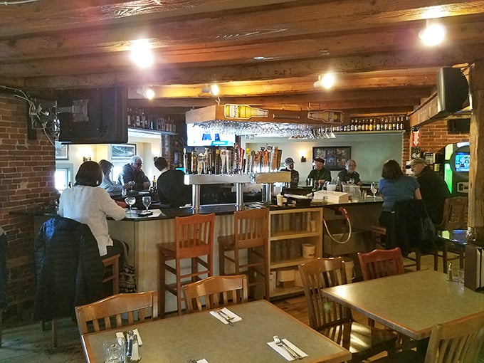 The bar area serves as command central for liquid happiness, where locals gather to debate everything from sports to sauce recipes.