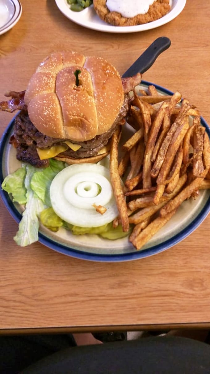 A burger built like a Midwestern linebacker – substantial, no-nonsense, and impossible to ignore. Those hand-cut fries deserve their own fan club.