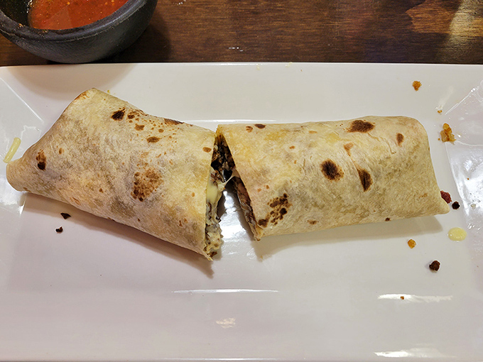 This burrito isn't just wrapped—it's swaddled with care, like a food baby born of rice, beans, and perfectly seasoned meat. Cut it open and watch the goodness escape.