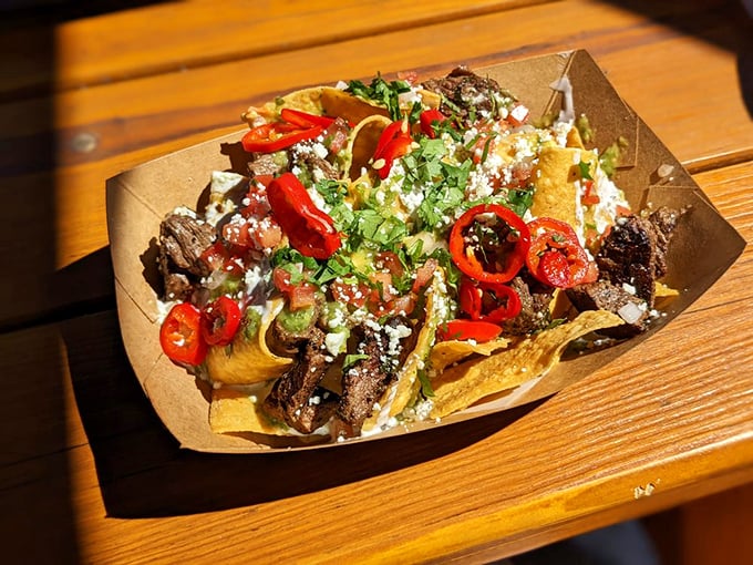 Nachos that refuse to be a mere appetizer. These carne asada-topped triangles of joy have main character energy and the cheese pull to prove it.