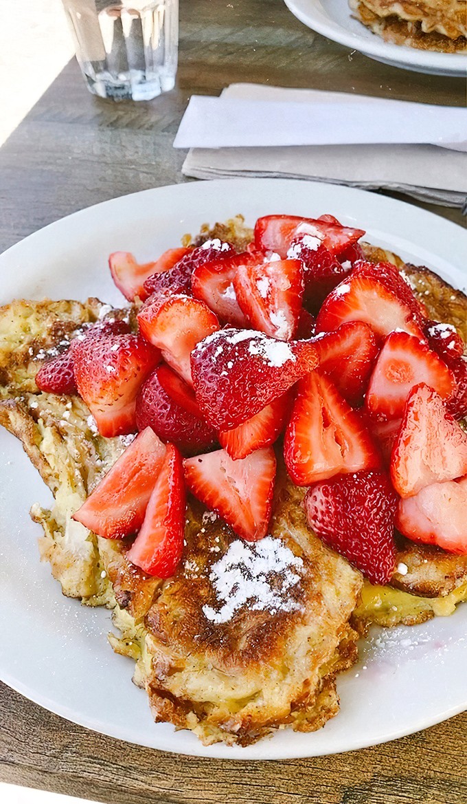 The strawberry pile isn't just generous—it's downright philanthropic. Berry hoarding has never looked so justified.