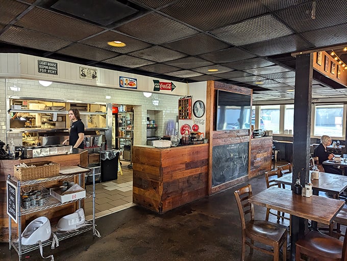 Where the magic happens – the open kitchen and wooden counter area invite diners to witness the choreography of comfort food creation.