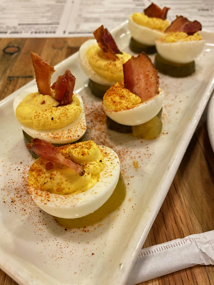 Deviled eggs topped with bacon—because sometimes the road to heaven is paved with devilishly good intentions and smoked pork.
