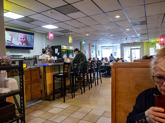 The dining room hums with conversation and coffee refills—a community gathering spot where strangers become neighbors over pie.
