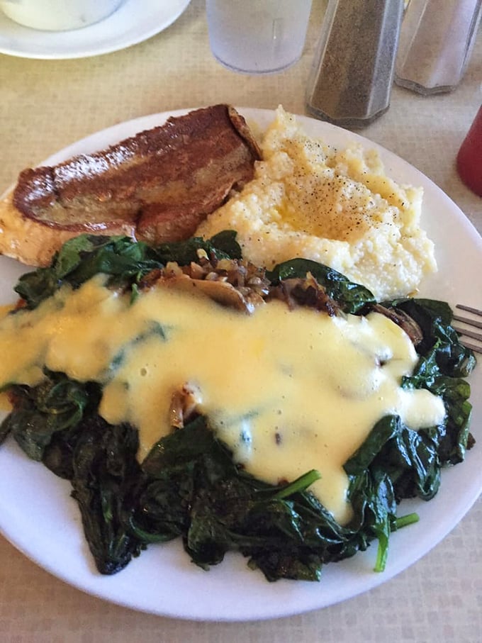 Eggs Florentine that would make Florence proud. Hollandaise sauce cascading over spinach like a creamy yellow waterfall—Michelangelo couldn't have sculpted it better.