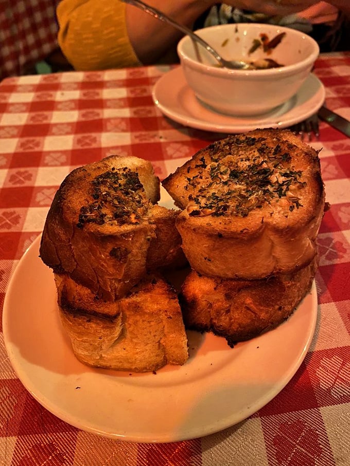 Garlic bread toasted to golden perfection. These slices aren't just bread—they're the perfect sauce-sopping tools engineered for maximum flavor capture.