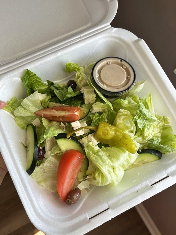 A Greek salad that doesn't skimp on the good stuff. Those olives and feta aren't just ingredients—they're the stars of this leafy show.