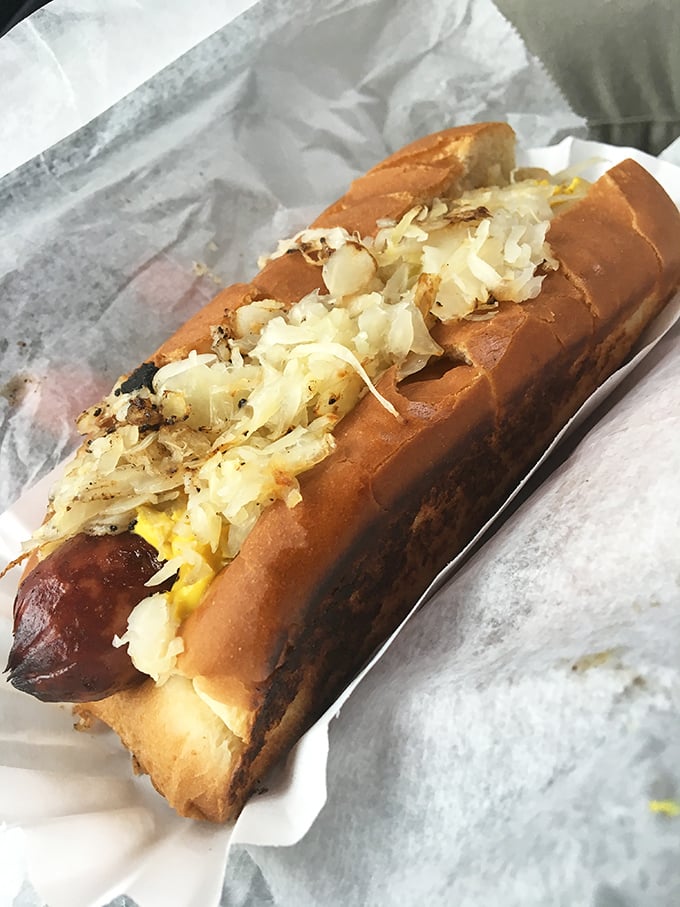 This isn't just a hotdog with sauerkraut—it's a flavor party where sweet, savory, and tangy are all VIP guests.