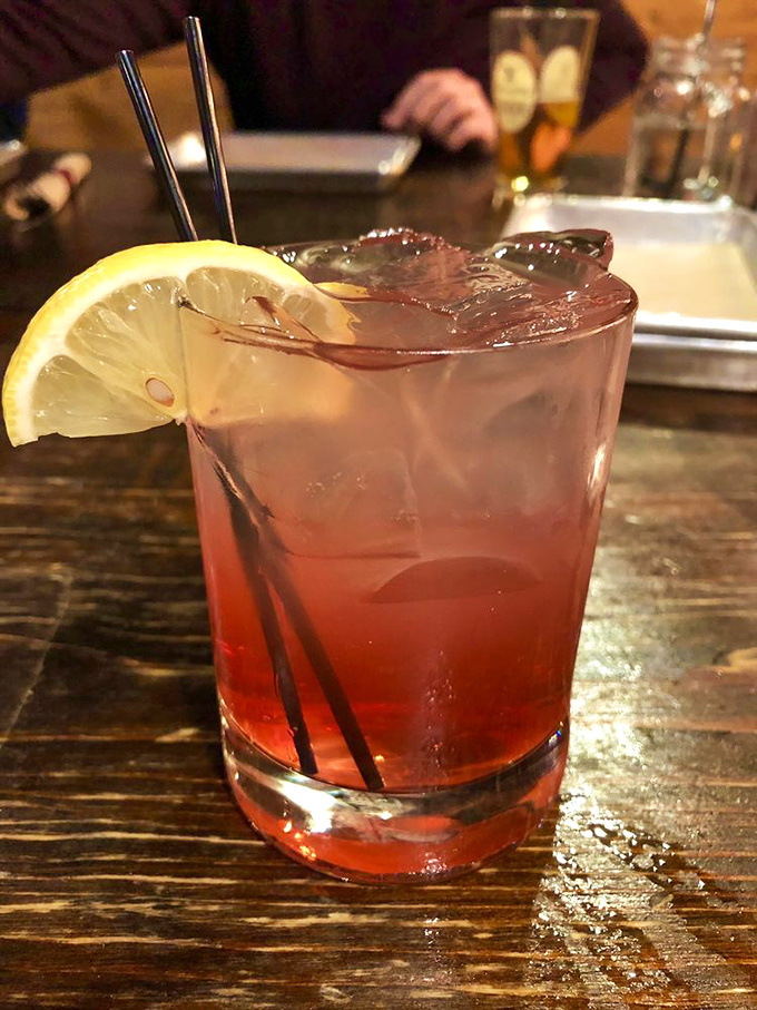 This isn't just a cocktail; it's summer in a glass. The huckleberry lemonade brings just enough sweetness to cut through all that savory barbecue.