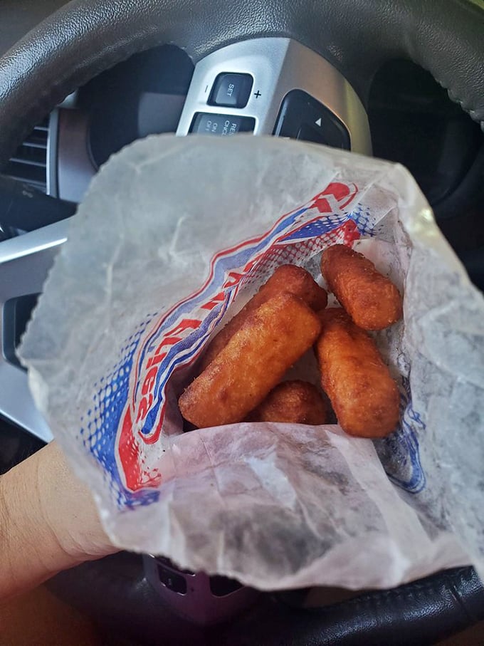 These aren't just mozzarella sticks; they're happiness cylinders. Crispy on the outside, molten cheese paradise on the inside—a perfect equation for joy.