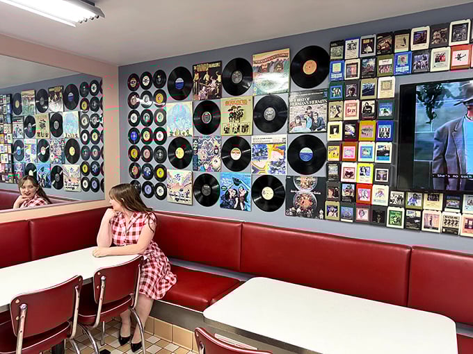 The vinyl record wall isn't just decoration—it's a musical time machine that pairs perfectly with your chocolate malt and nostalgia.
