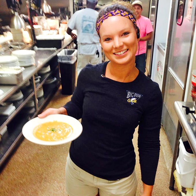 Beyond the kitchen doors, dedicated staff prepare ocean treasures with care. The human element behind every perfect plate.