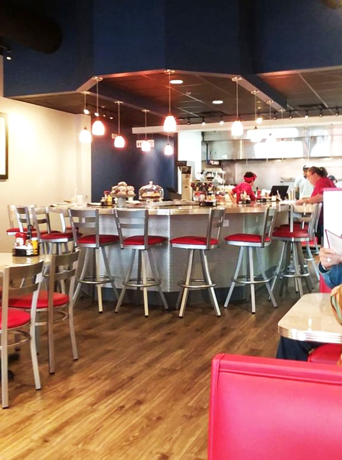Counter seating with a view of the action – where solo diners never feel alone and regulars have their unofficial assigned seats.