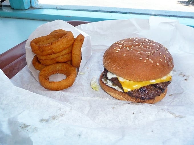 The classic combo that's outlasted countless food trends. While acai bowls come and go, this burger and onion rings partnership remains undefeated.