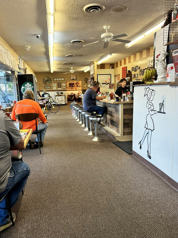 The counter seating – where solo diners become temporary neighbors and the rhythm of breakfast service unfolds like a well-rehearsed ballet.