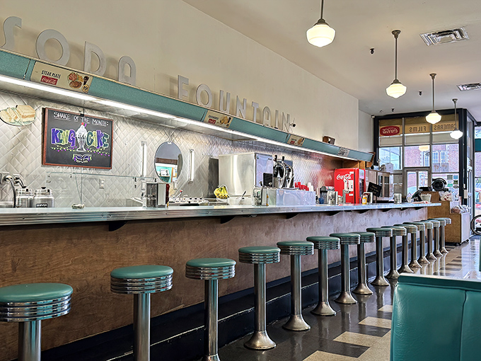 Those turquoise stools aren't just seating—they're front-row tickets to the best show in town: American diner culture, unfiltered.