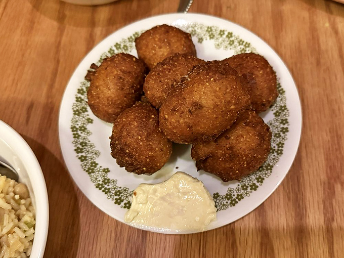 Hush puppies so perfectly golden they belong in Fort Knox. Crispy exterior giving way to pillowy interior—the textural equivalent of a standing ovation.
