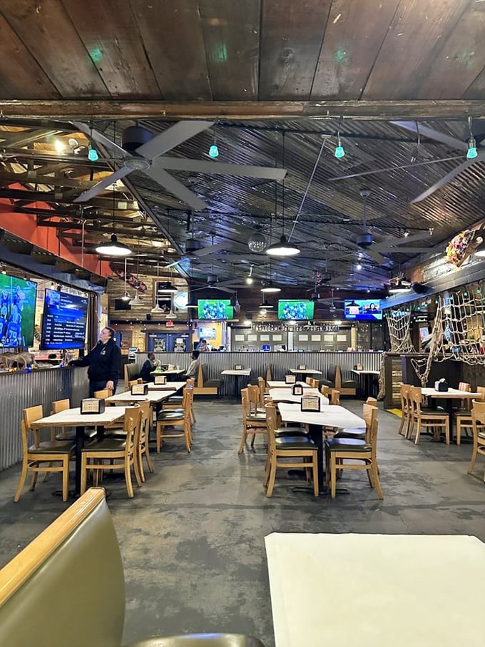 The dining room feels like the world's most comfortable ship's galley—corrugated metal, wooden beams, and the promise of seafood treasures.