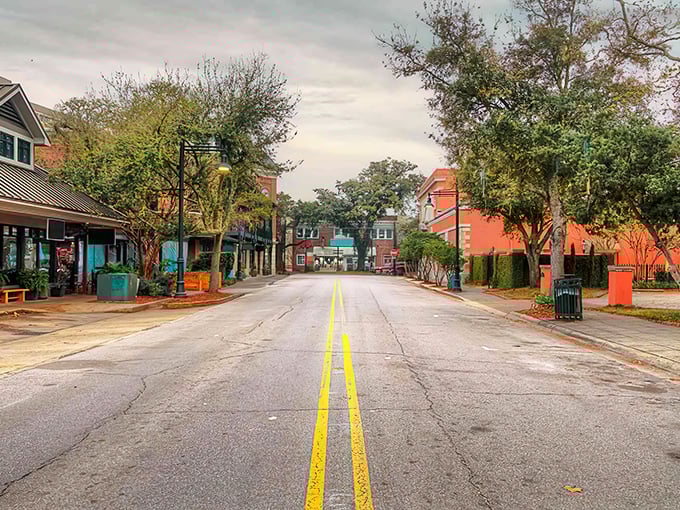Colorful storefronts line brick streets in Ocean Springs – coastal living with prices that won't sink your retirement ship.