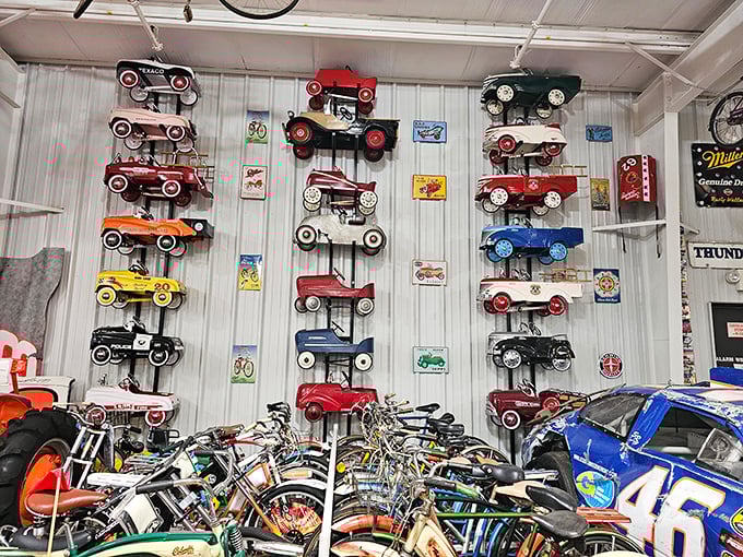 Wall-to-wall childhood dreams! This collection of pedal cars and bicycles proves automotive passion starts early—no driver's license required.