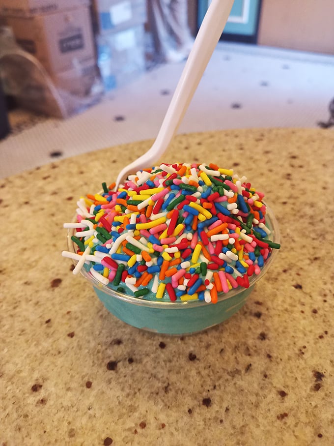 Blue ice cream topped with a rainbow explosion of sprinkles—because sometimes your inner eight-year-old deserves to order dinner without adult supervision.
