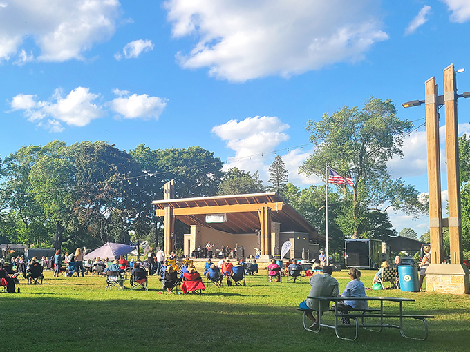 Summer concerts in the park—where strangers become neighbors and everyone pretends they're not judging each other's portable chair selections.
