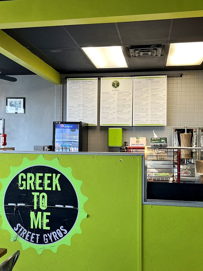 The lime-green counter announces "this isn't your yia-yia's formal Greek restaurant"—it's where street food meets Kentucky convenience.
