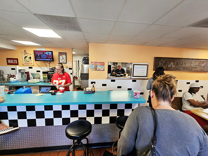 The black and white checkered counter feels like breakfast's finish line—where hungry patrons become satisfied customers in record time.