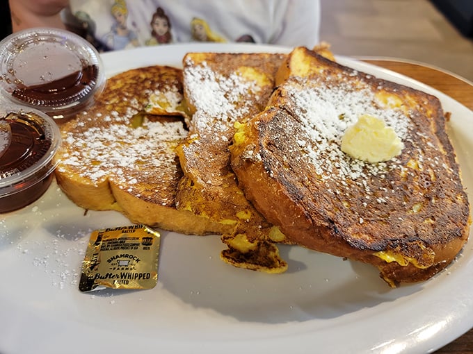 French toast that makes waking up early a pleasure rather than a chore. Golden, crispy edges giving way to custardy centers – breakfast nirvana achieved.
