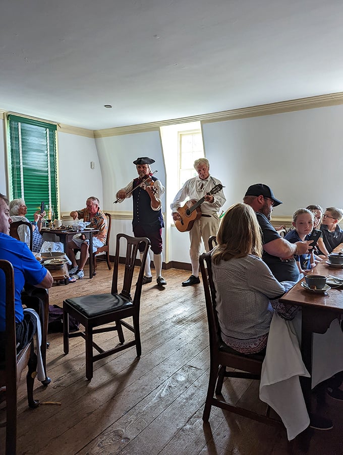 Dinner and a show, 18th-century style—where musicians in colonial garb serenade you with period tunes instead of an endless Spotify playlist.