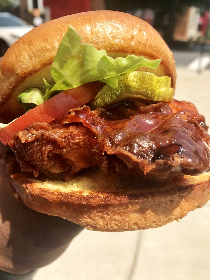 This isn't just a sandwich—it's a flavor explosion with slaw providing the perfect cool counterpoint to that magnificent chicken.