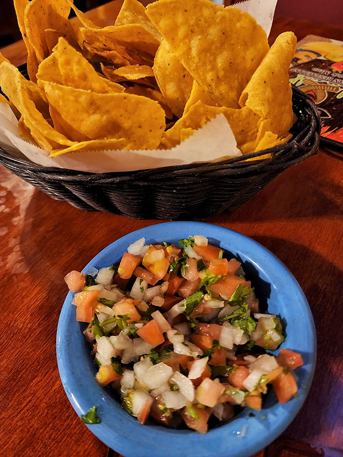 Those aren't just chips and salsa—they're the opening act that sets the tone for the flavor concert about to begin.