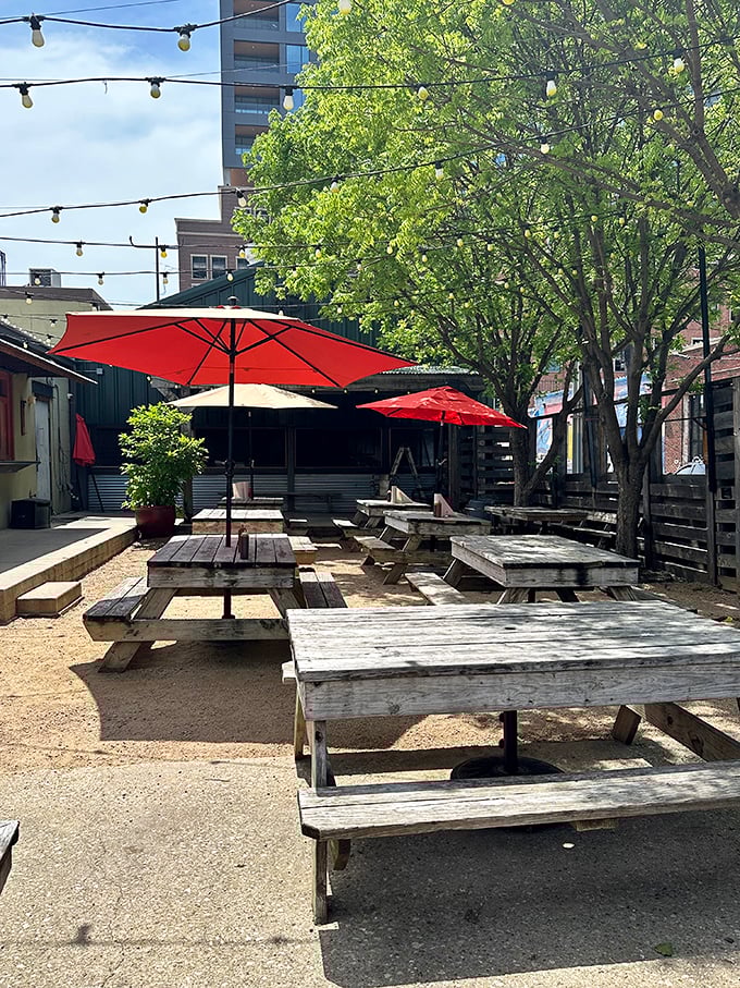 The outdoor seating area—where picnic tables under string lights create the perfect setting for making memories over meat and sides.