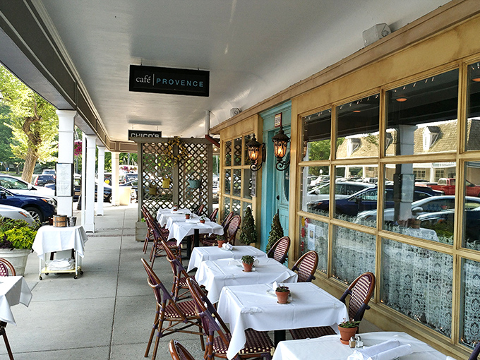 Sidewalk dining channels the essence of European café culture—white tablecloths, wicker chairs, and the gentle rhythm of an afternoon spent savoring rather than rushing.